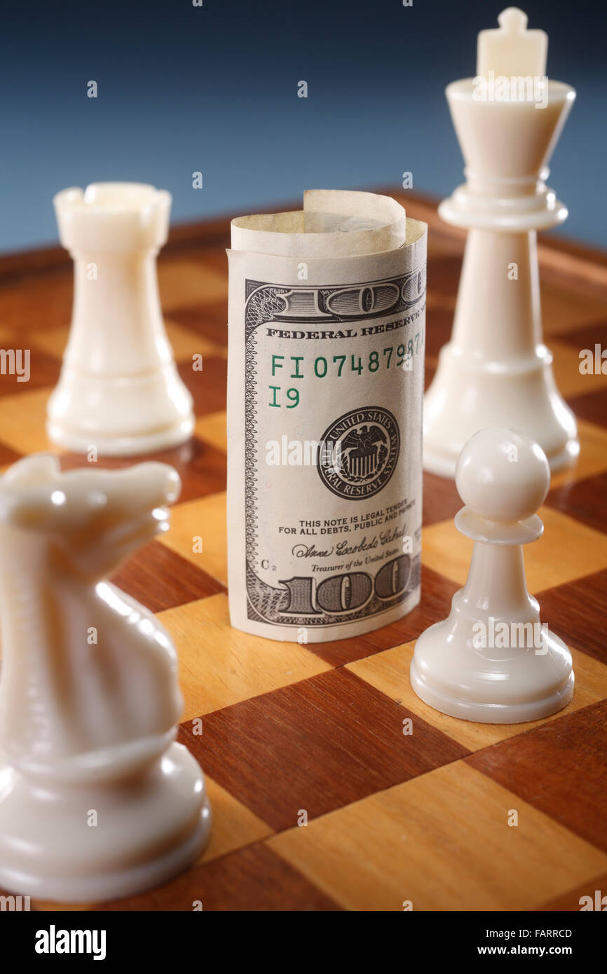 stock image of dollar bill on a chess board Stock Photo - Alamy