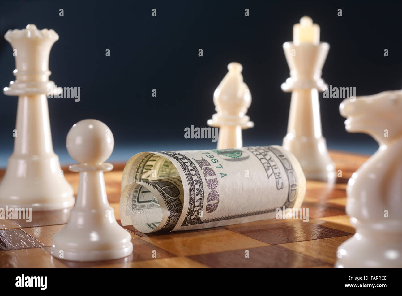 stock image of dollar bill on a chess board Stock Photo - Alamy