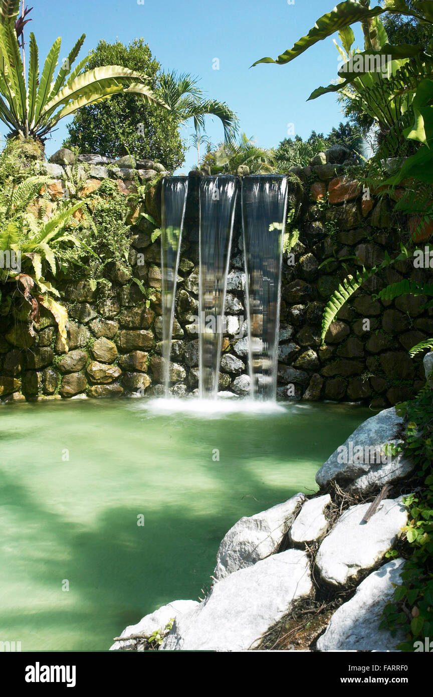 Beautiful landscape with a waterfall and green Stock Photo - Alamy