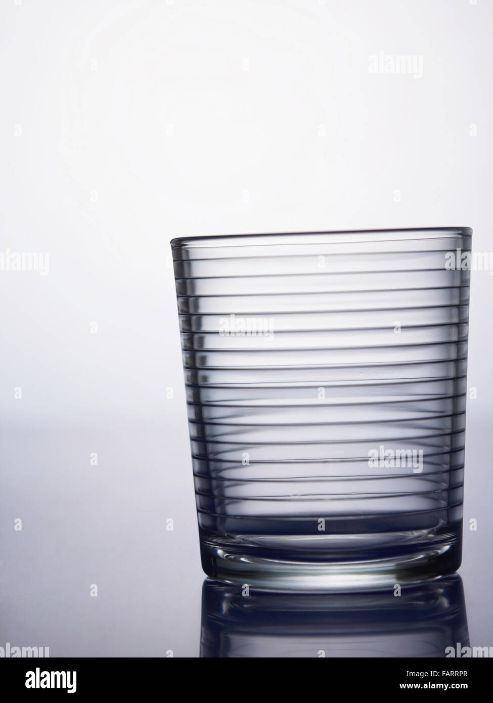Empty glass isolated on a plain background Stock Photo - Alamy