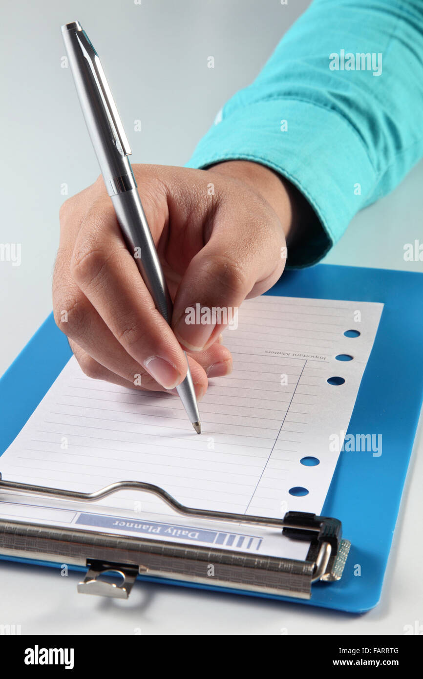 Blank daily planner note with a pen on a Clip Board, ready to write ...