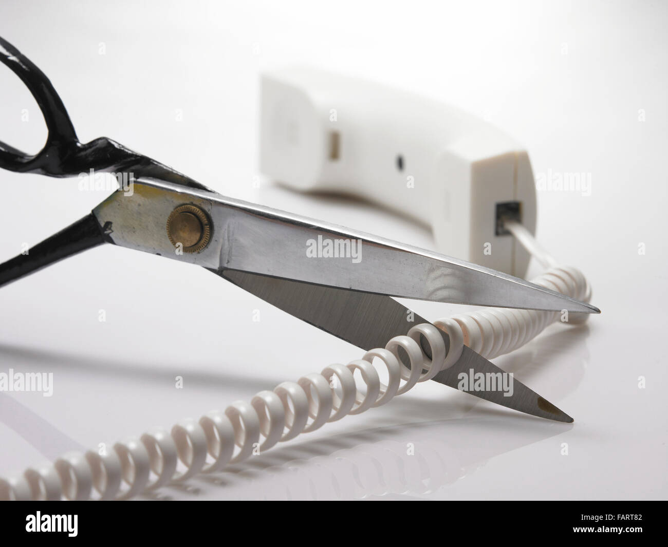 cutting away the cord of the phone Stock Photo - Alamy