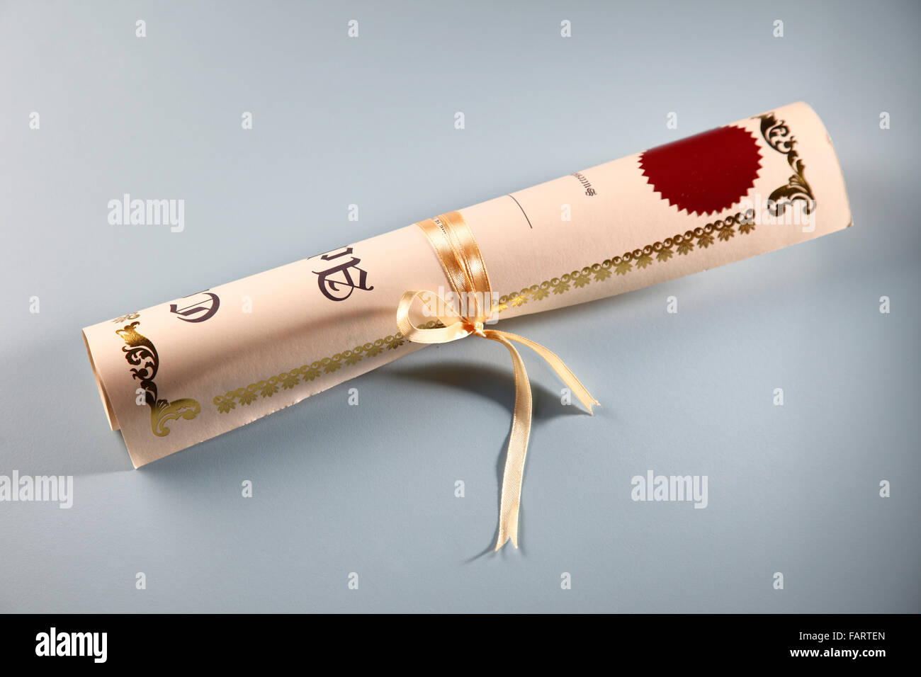 rolled certificate or diploma on the plain background Stock Photo - Alamy