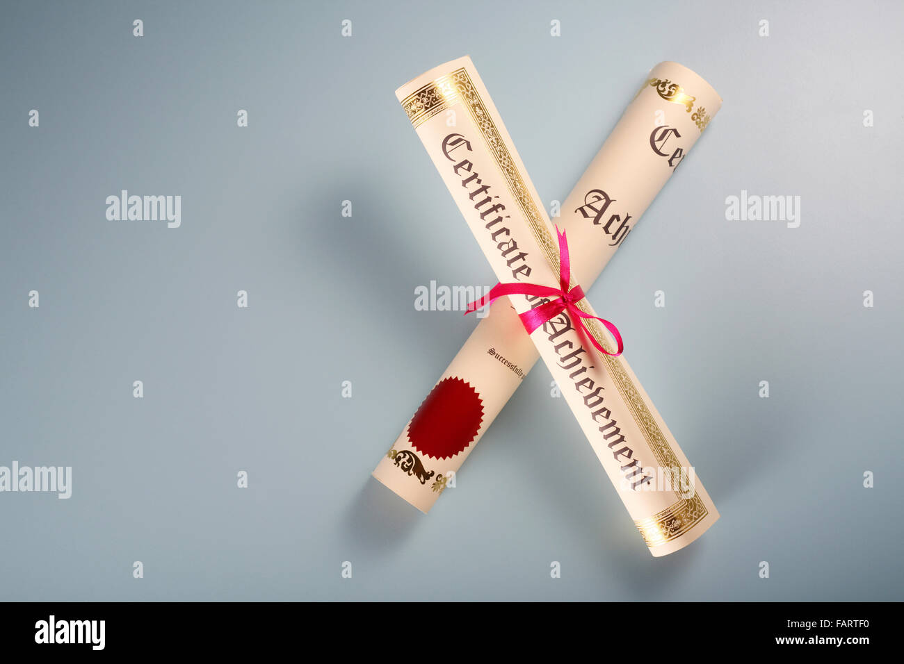 rolled certificate or diploma on the plain background Stock Photo - Alamy