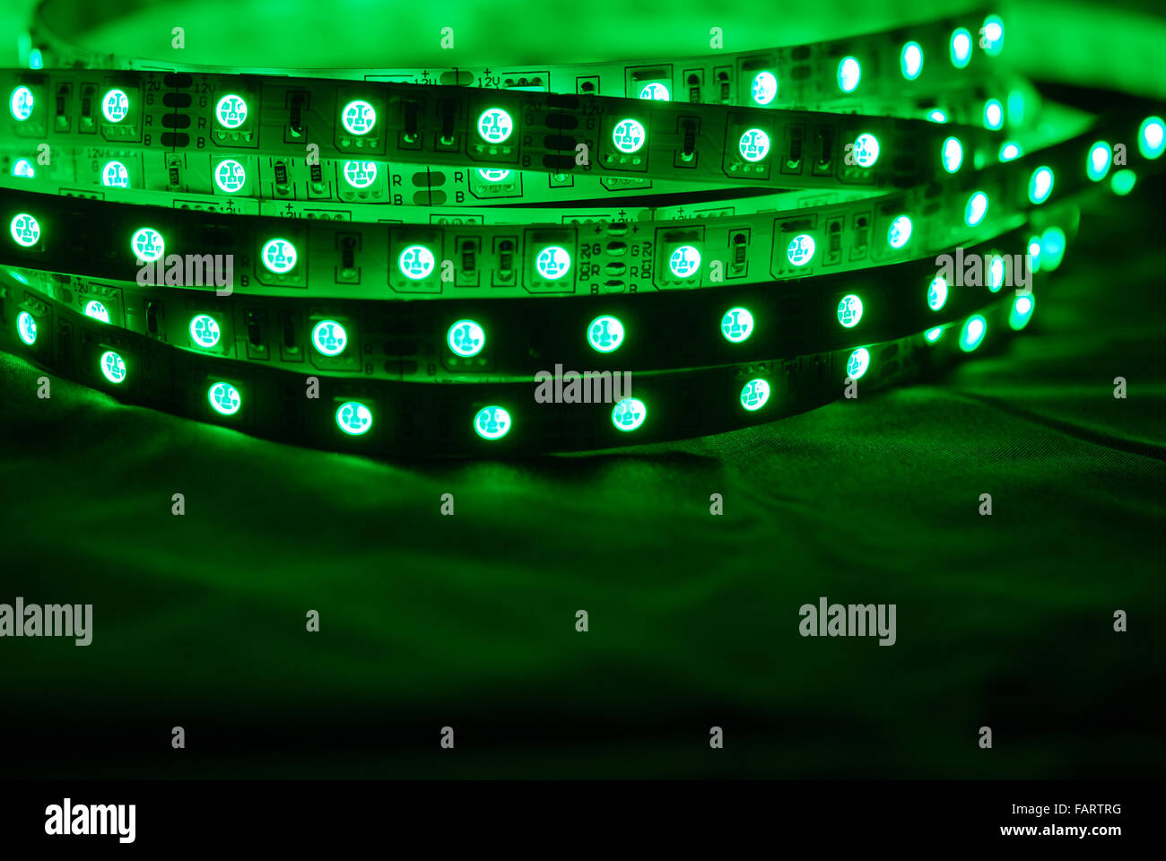 Green led strip on the background of textile Stock Photo - Alamy
