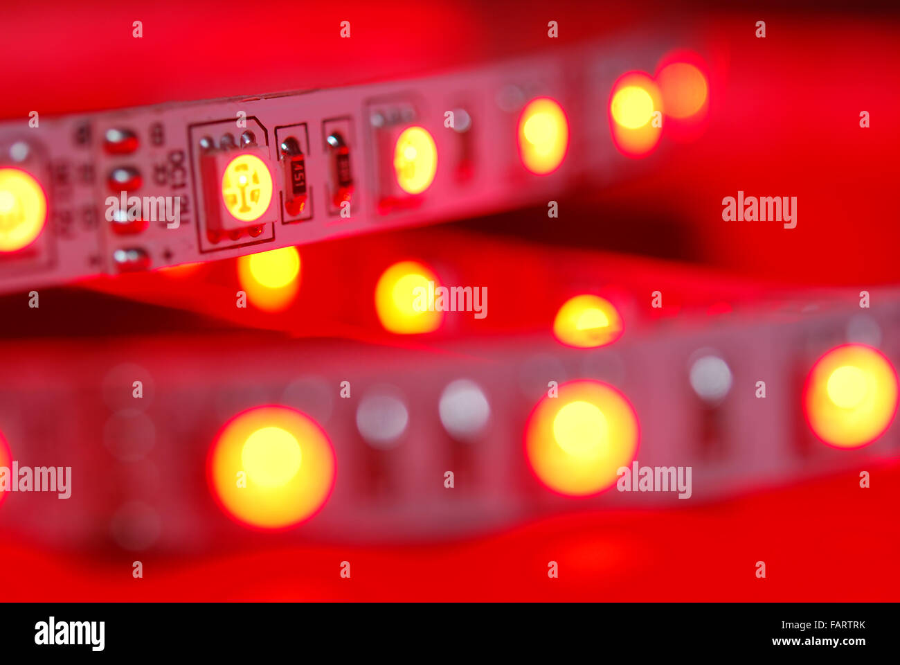 red led strip on the background of red textile Stock Photo - Alamy