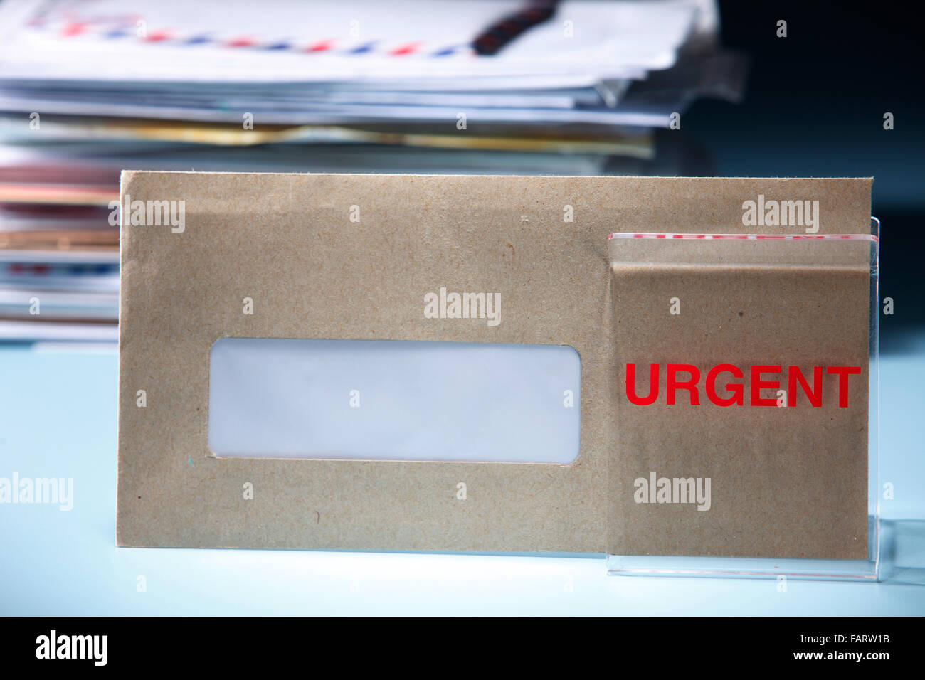 Stack Of Envelopes with urgent sign Stock Photo - Alamy