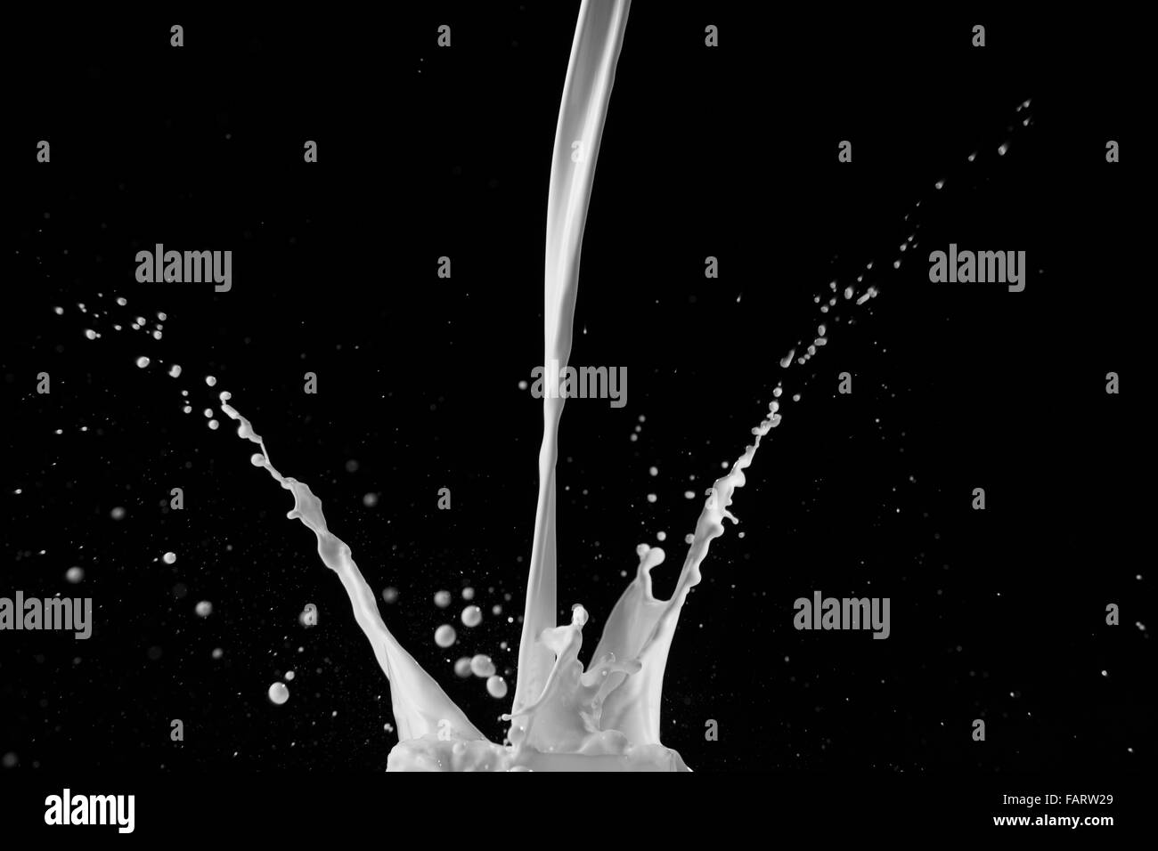 Milk splash on black hi-res stock photography and images - Alamy
