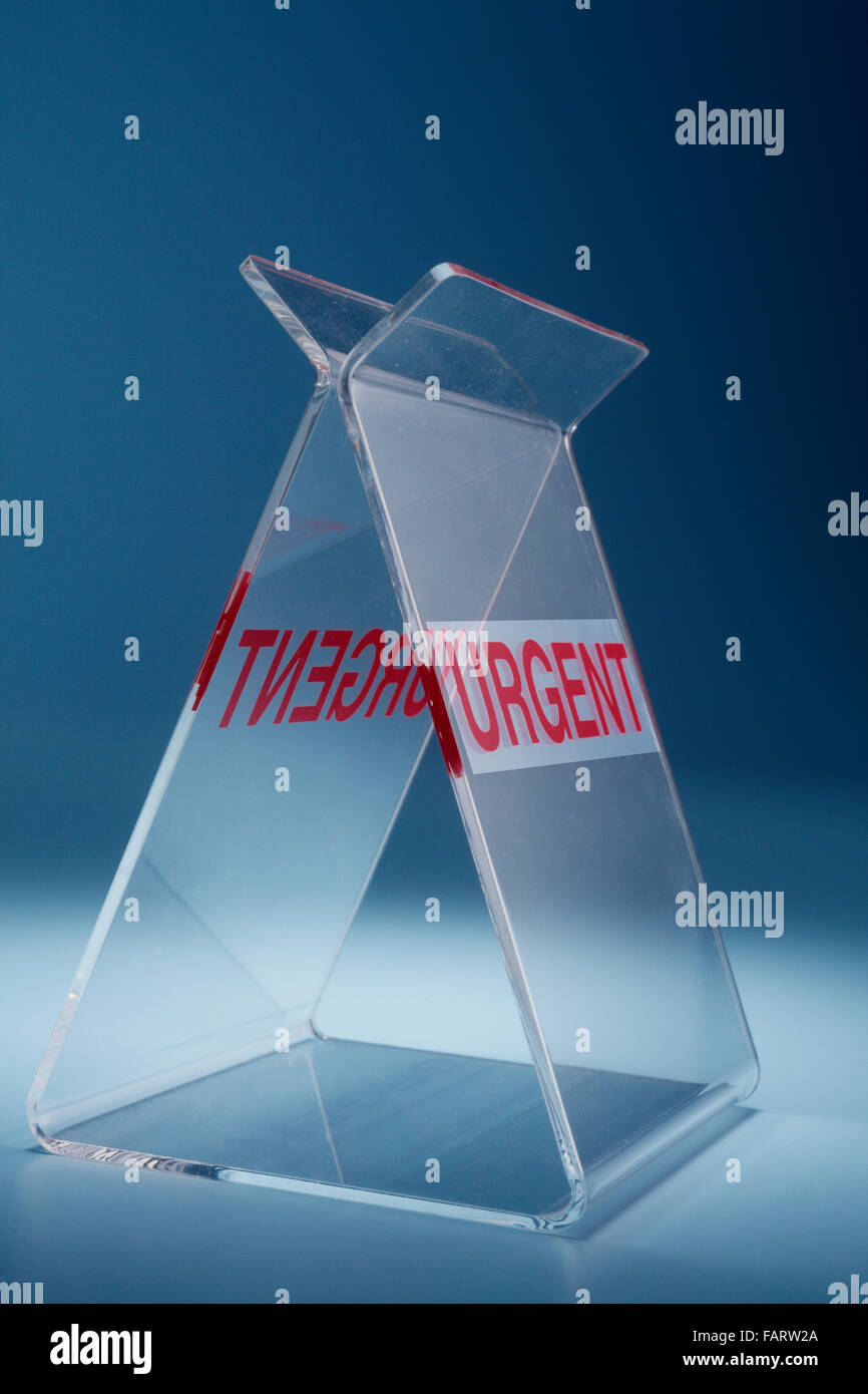 stock image of document holder with urgent sign Stock Photo - Alamy