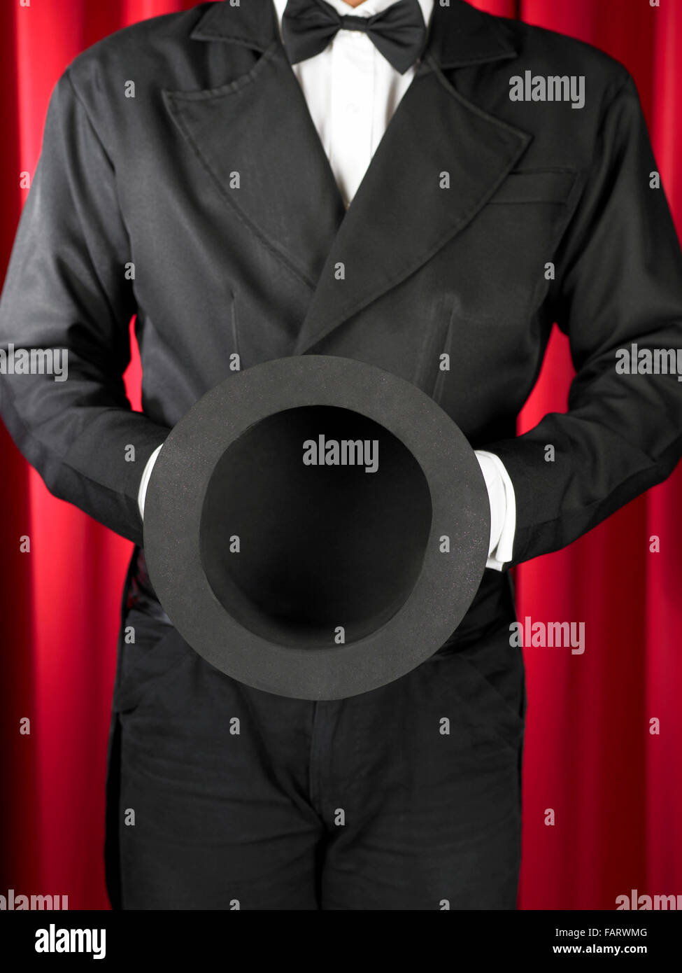 magician offer / showing his empty hat Stock Photo - Alamy