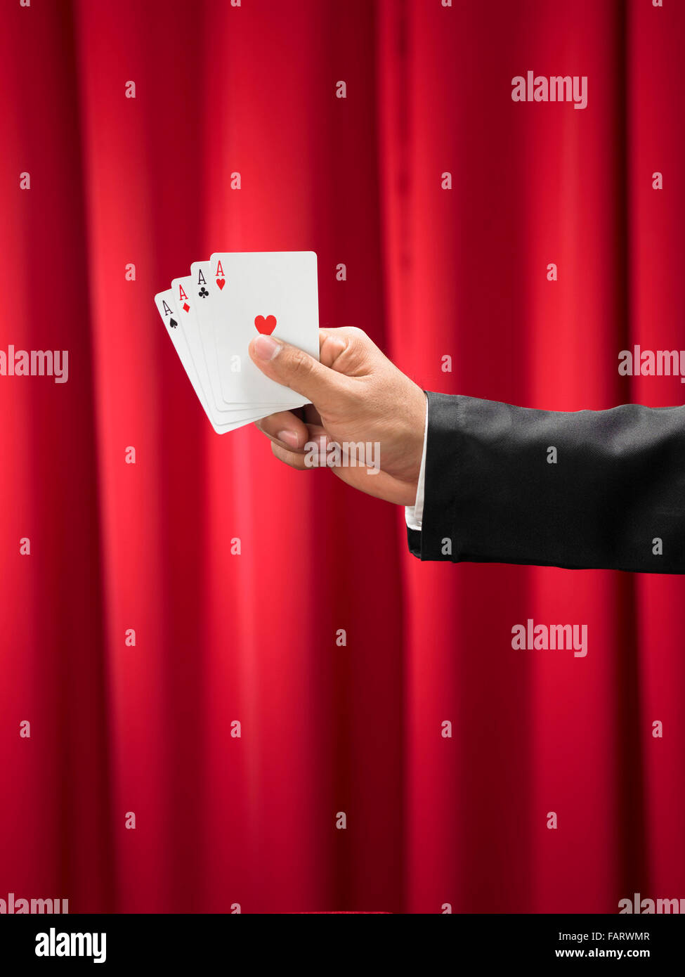 Magician make performance with card deck and top-hat Stock Photo - Alamy