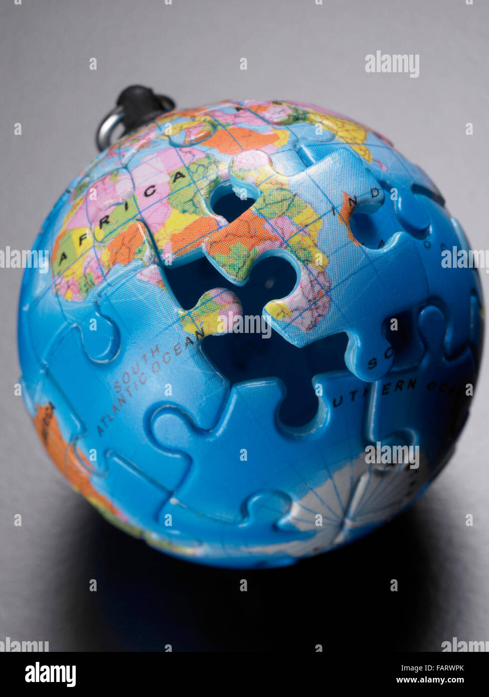 Earth puzzle in progress Stock Photo - Alamy