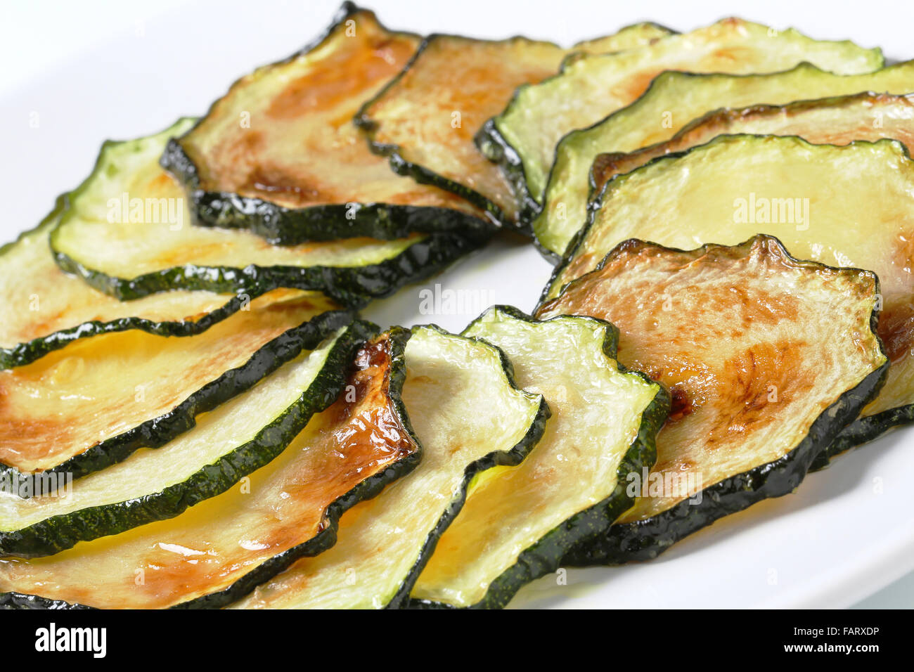 circle of thin slices of roasted zucchini Stock Photo - Alamy