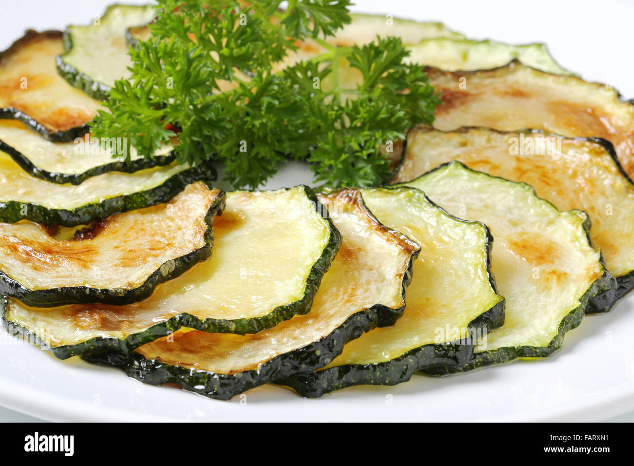 circle of thin slices of roasted zucchini Stock Photo - Alamy