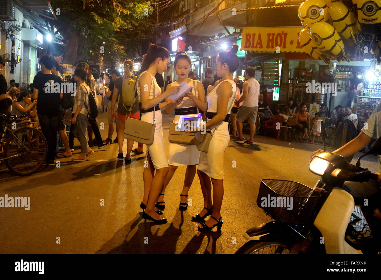 Girls selling cigarettes tobacco promotion street Stock Photo - Alamy