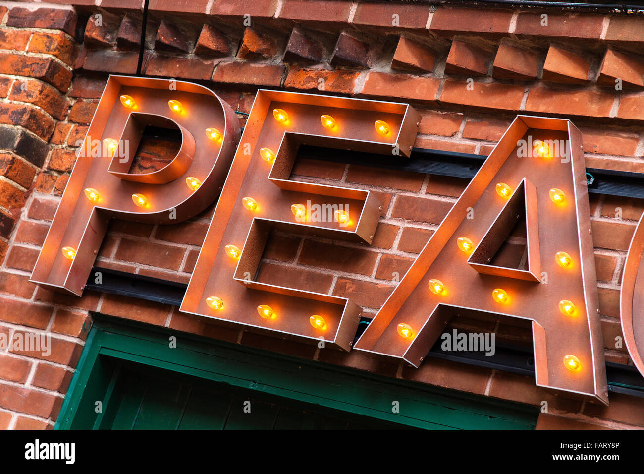Peace sign on brick wall Stock Photo - Alamy