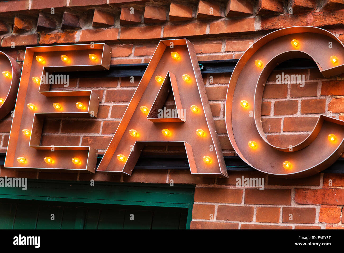 Peace sign on brick wall Stock Photo - Alamy