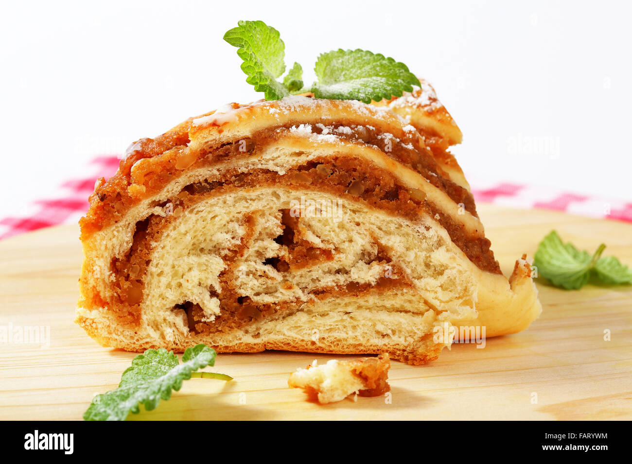 slice of yeast cake with nut filling Stock Photo - Alamy