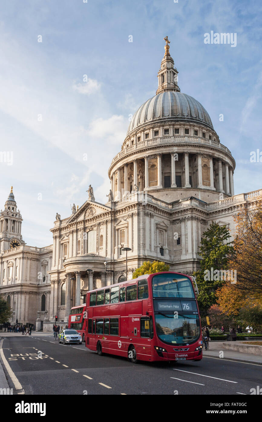 Red london bus passes in front st pauls hi-res stock photography and ...