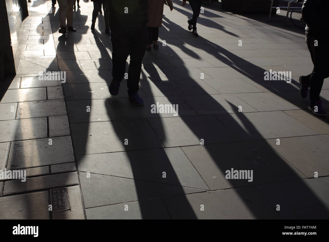 shadows of people walking in london Stock Photo - Alamy