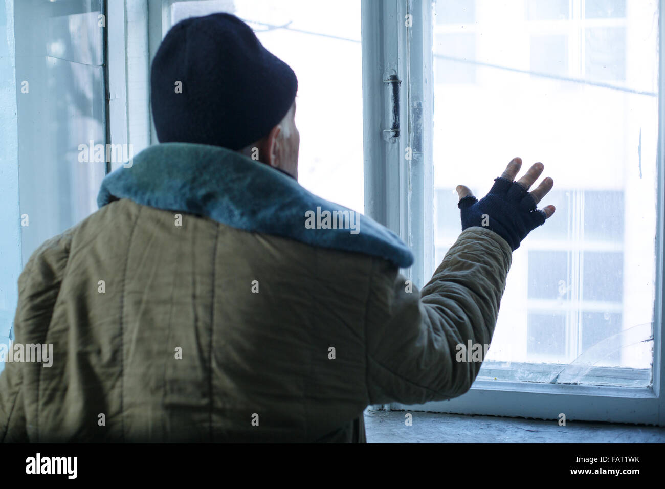 Homeless man is looking out of the window Stock Photo - Alamy