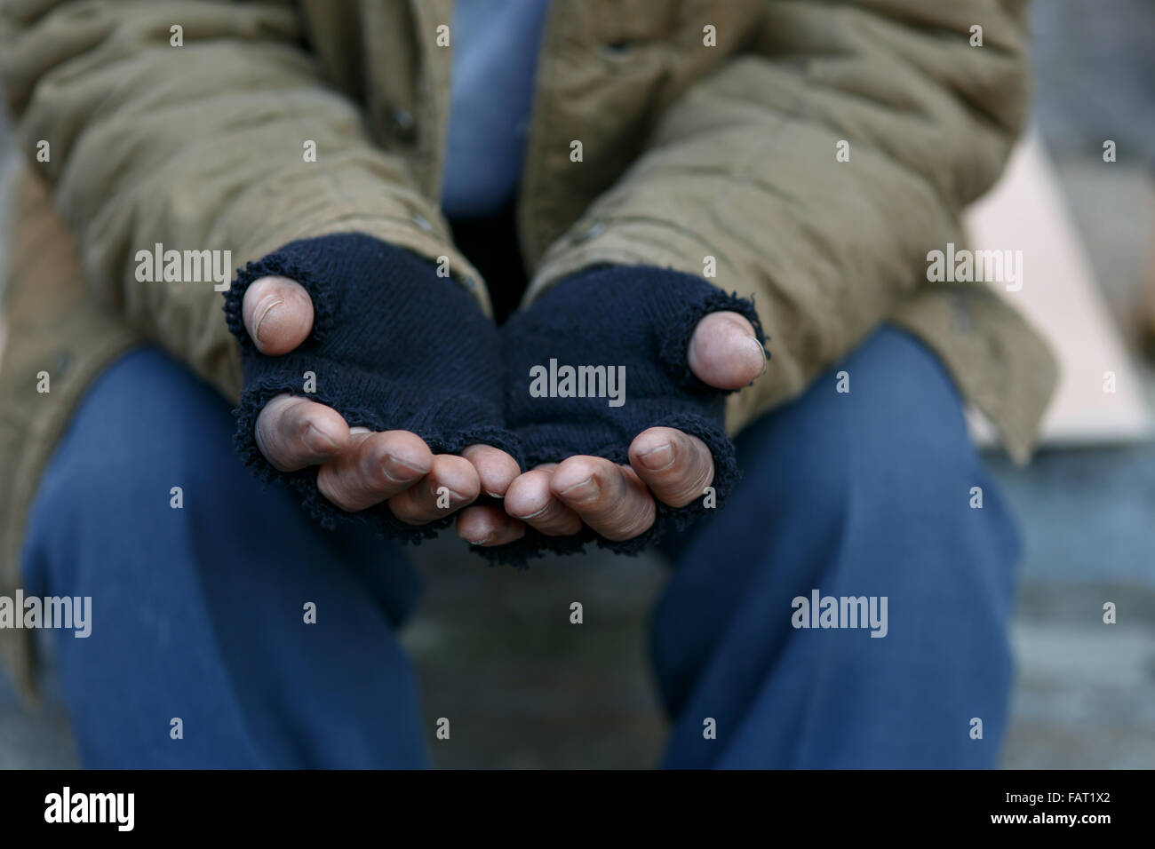 Homeless man asking for help Stock Photo - Alamy