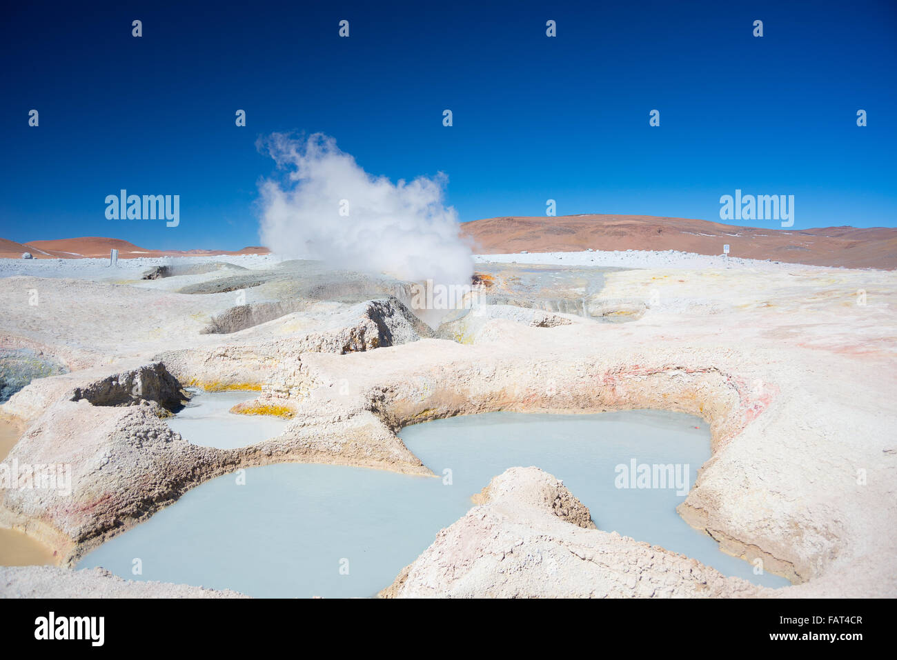 Steaming hot water ponds and mud pots in geothermal region of the ...