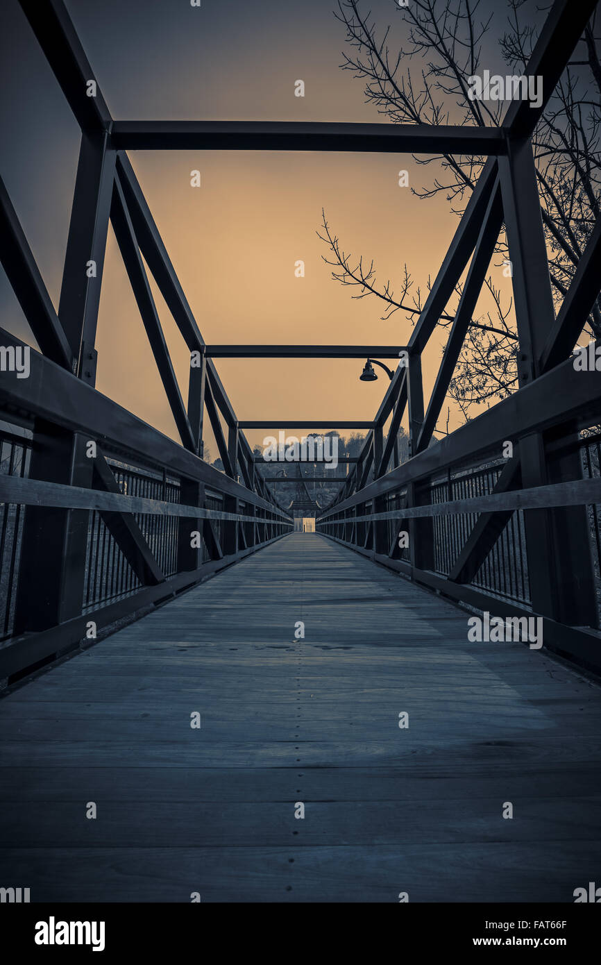 A long leading line look at a bridge at dusk Stock Photo - Alamy