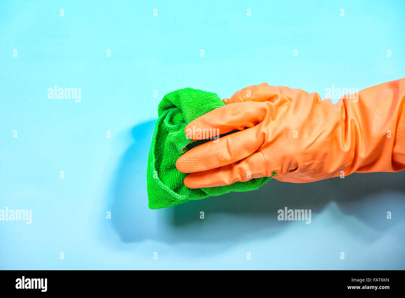 Green cleaning rag in gloved hand Stock Photo - Alamy