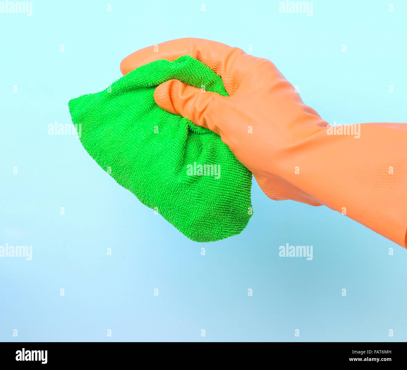 Green cleaning rag in gloved hand Stock Photo - Alamy