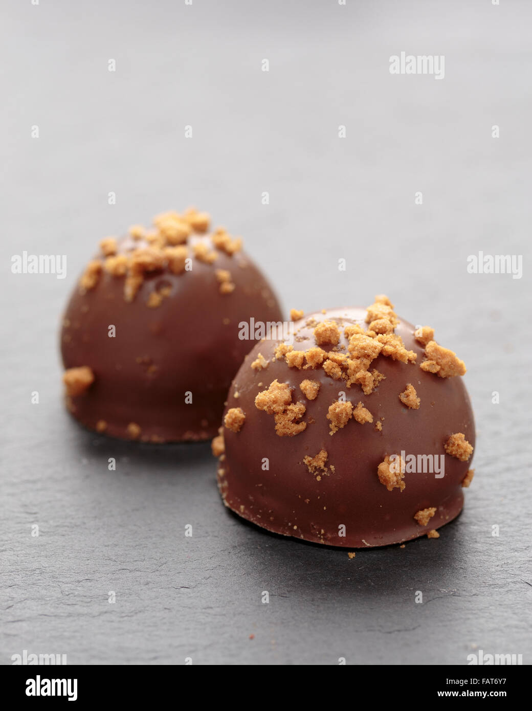 Close up of two fine chocolate bonbons Stock Photo - Alamy