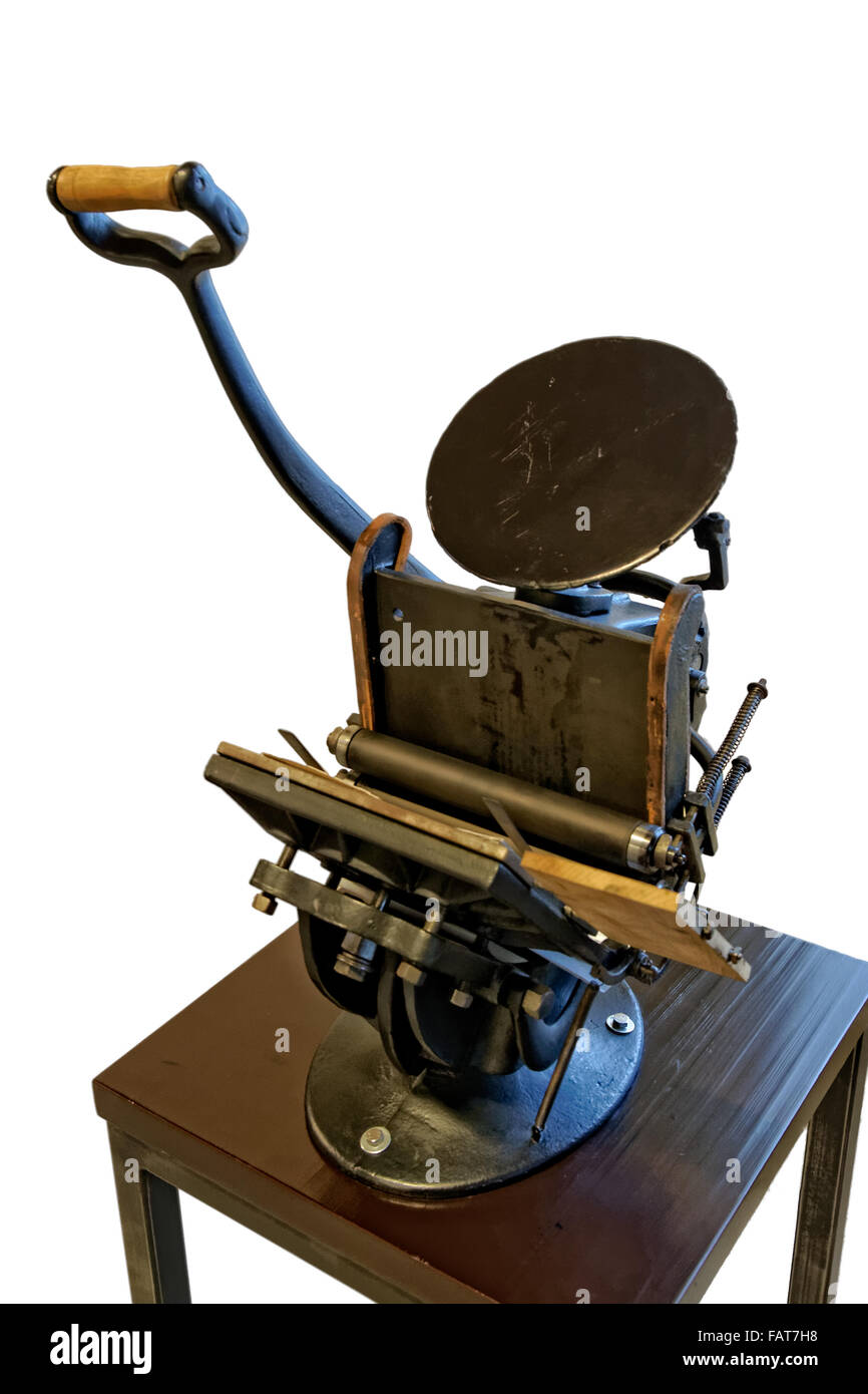 Cast iron table top hand cranked printer Stock Photo - Alamy
