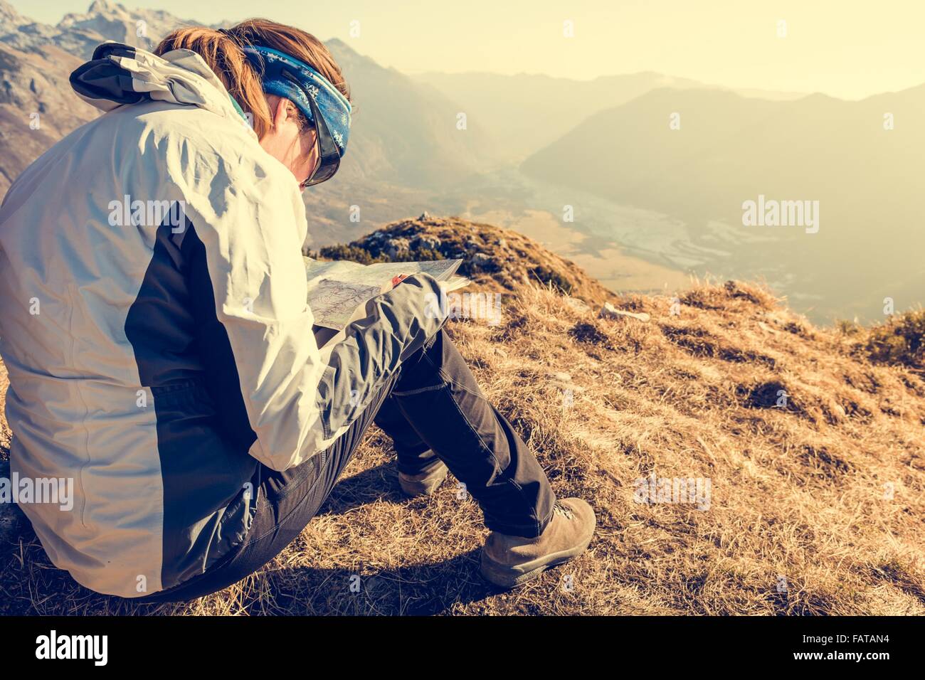 Hiker studying a map Stock Photo - Alamy