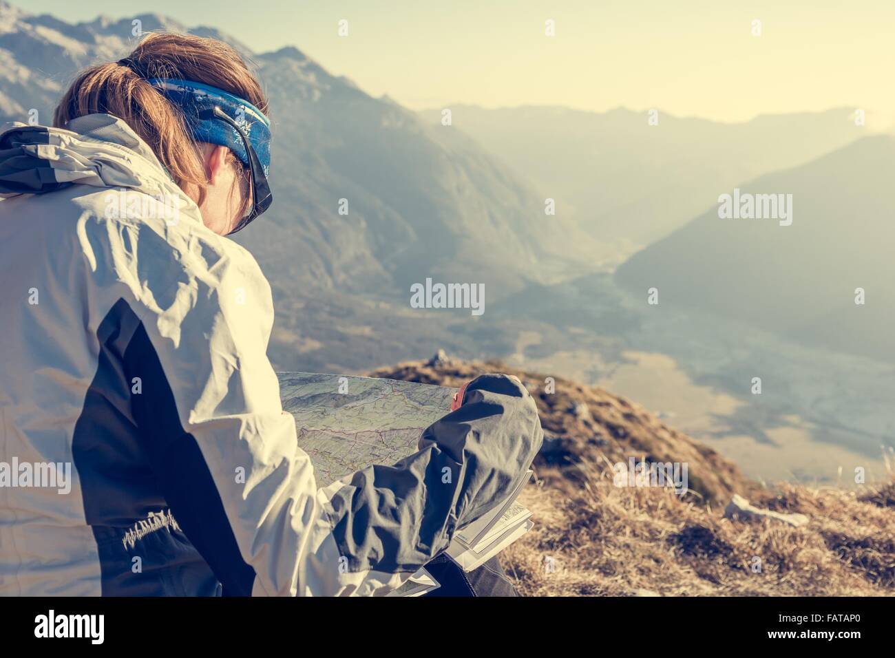 Hiker studying a map Stock Photo - Alamy