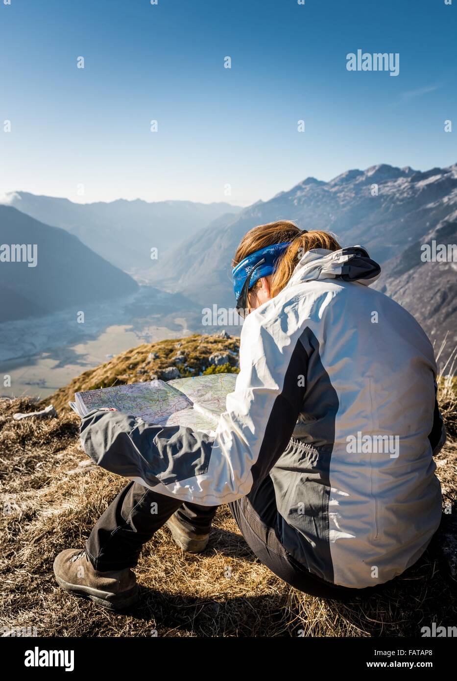 Hiker studying a map Stock Photo - Alamy