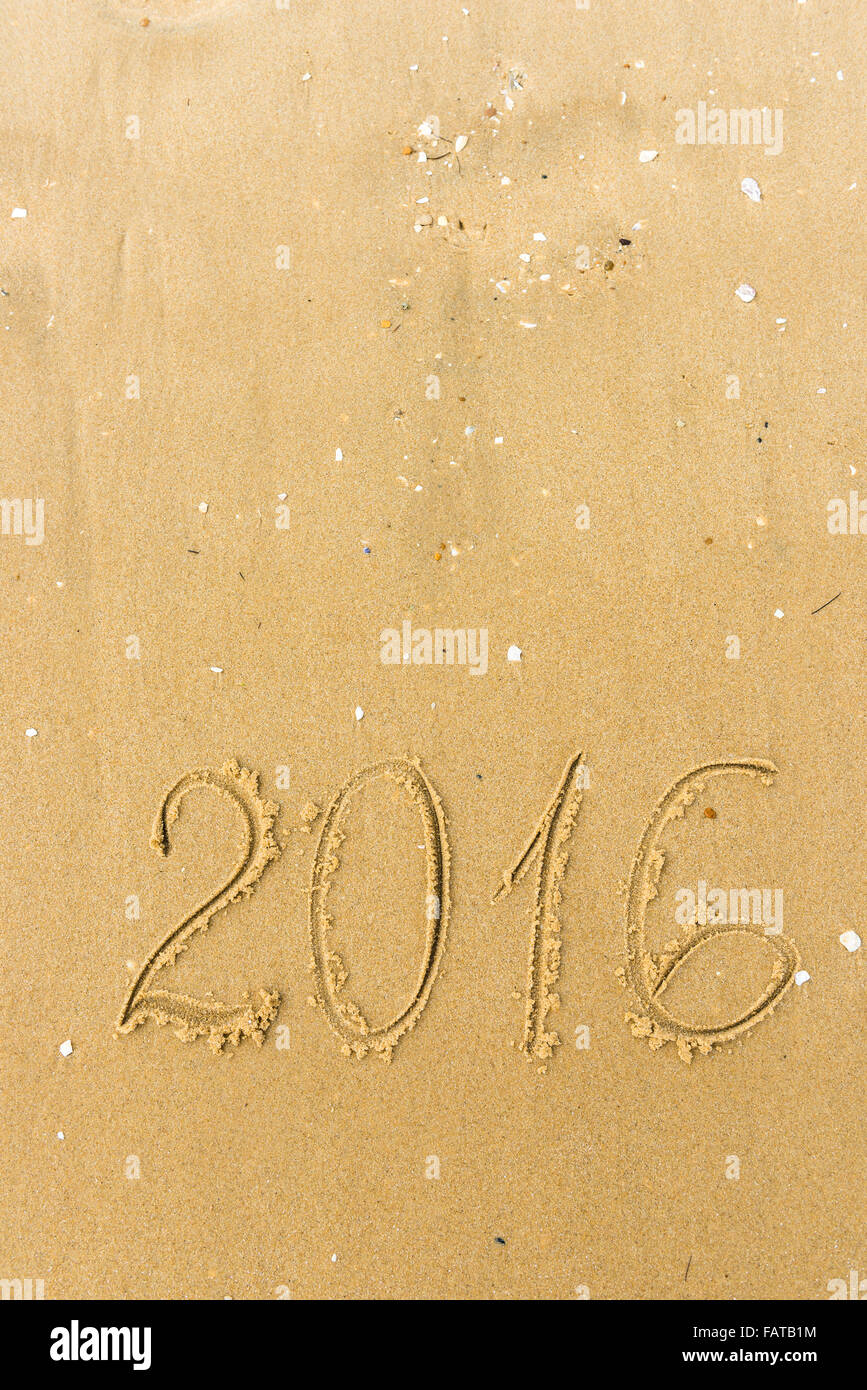 2016 Year written on the beach. sand background Stock Photo - Alamy