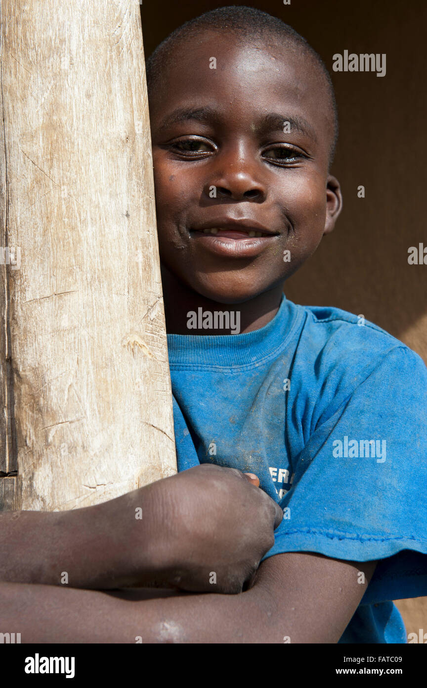 Young Kenyan boy smiling and looking happy, despite living in poverty ...