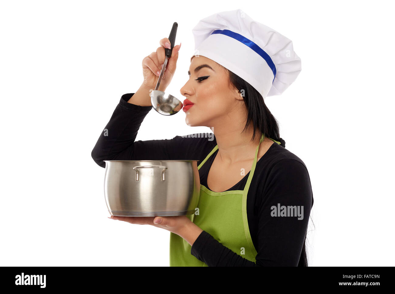 Latino woman chef tasting soup with a ladle, isolated on white Stock ...