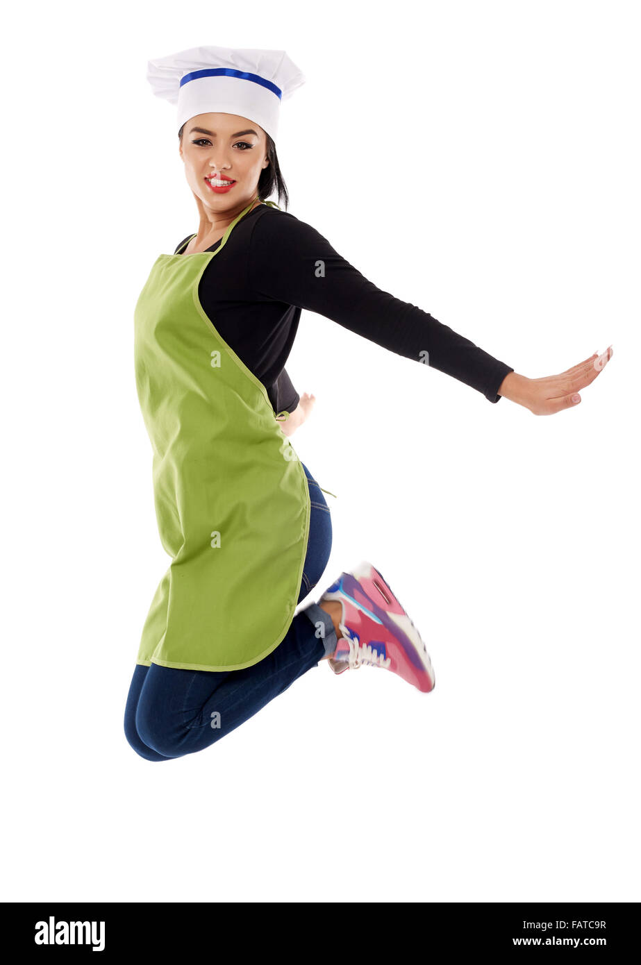 Latino woman cook jumping for joy isolated on white background Stock ...