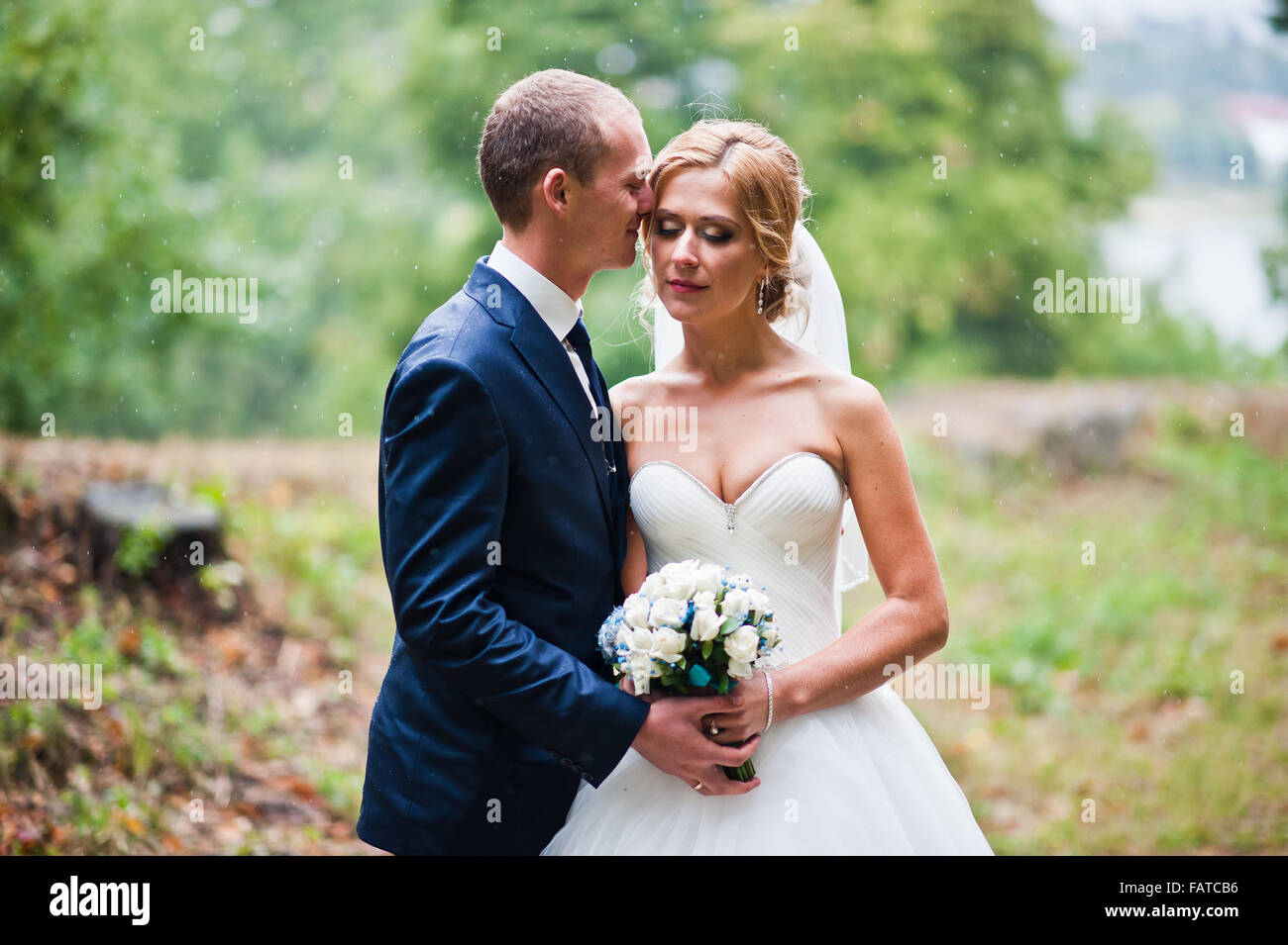 Married walking in the rain at park Stock Photo - Alamy