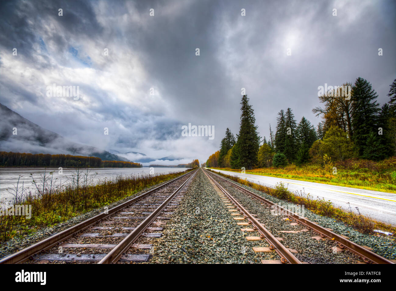 Railway Tracks running through the mountains of British Columbia Canada ...