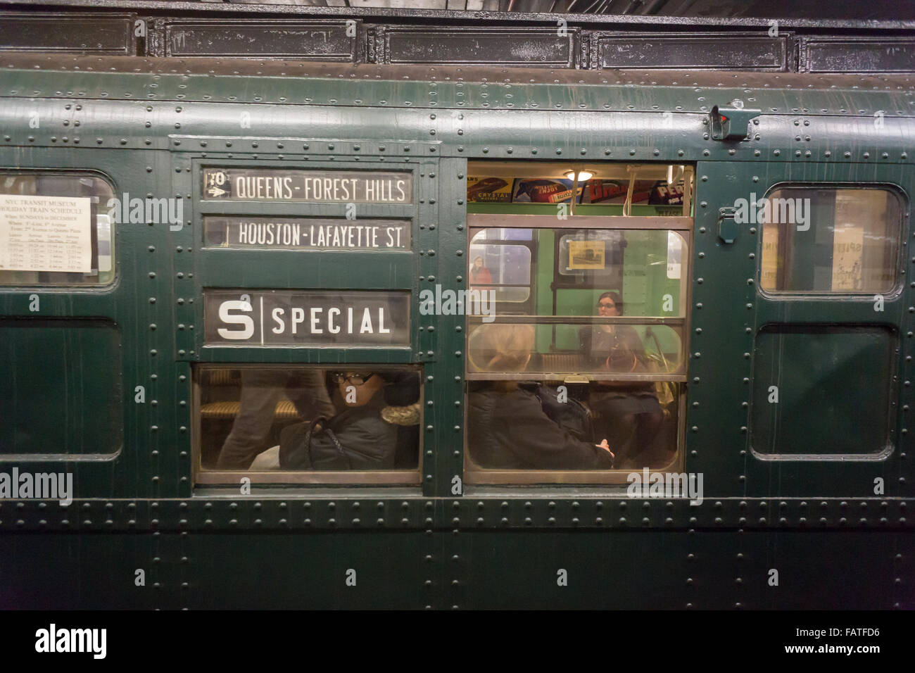 New Yorkers, tourists and subway buffs travel on a vintage MTA ...