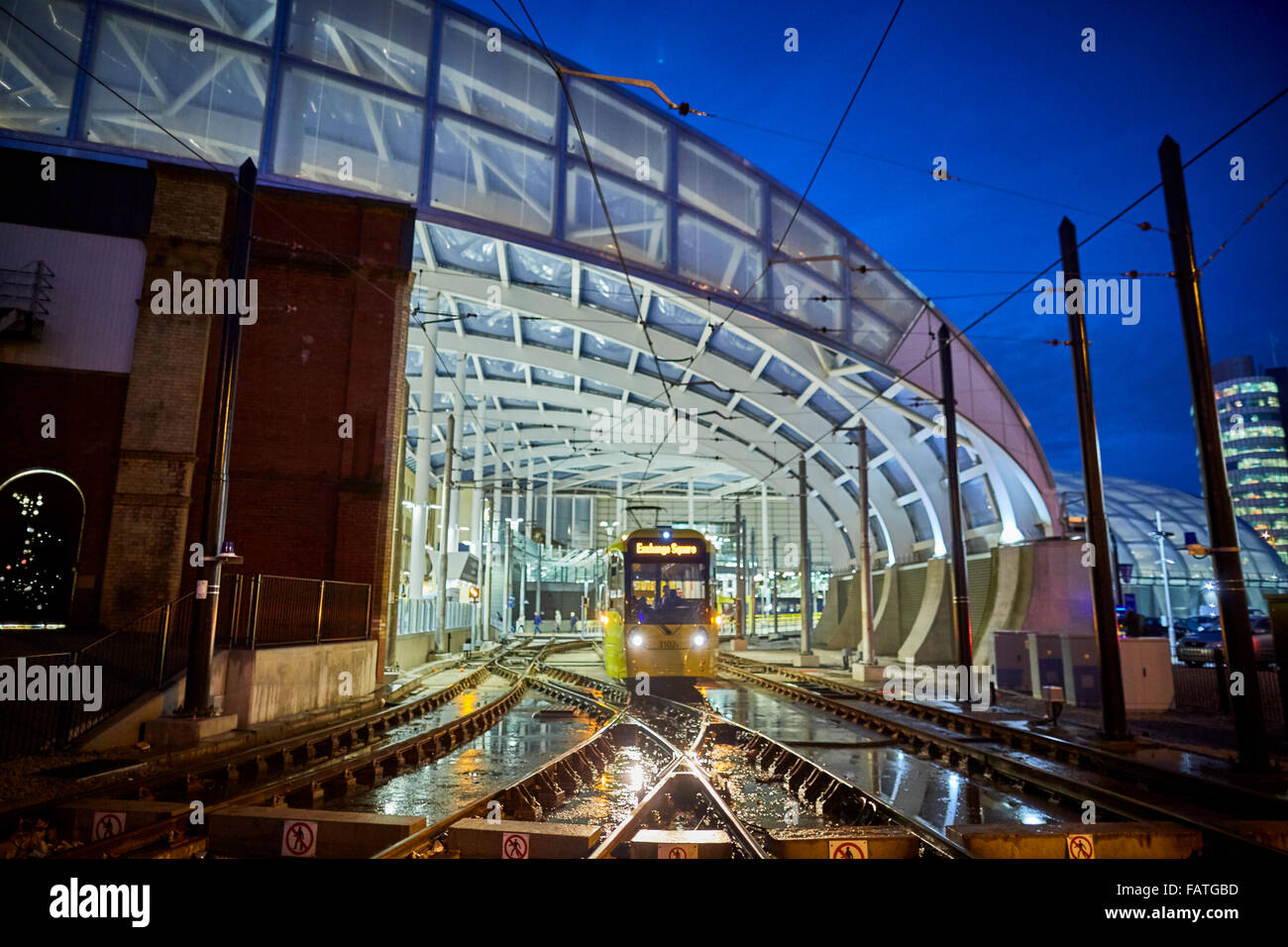 Manchester Metrolink tram along second crossing at Victoria Station ...