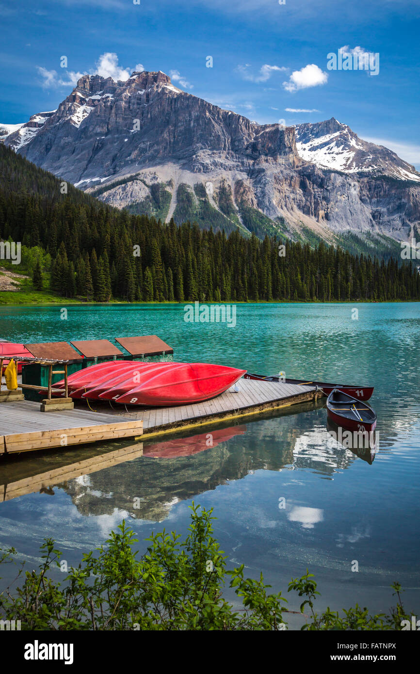 Red canoes on the dock at Emerald Lake, Yoho National Park, British ...