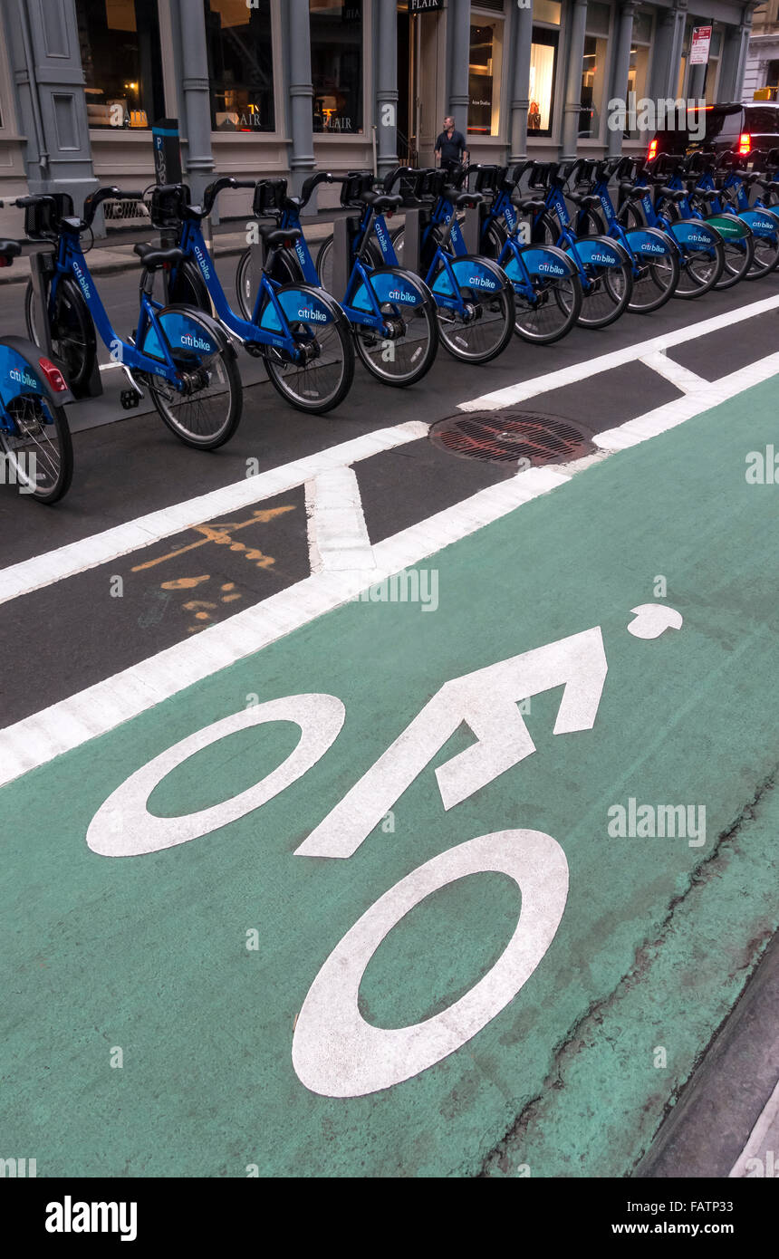 A bicycle path on a street in Soho in New York City next to a Citi Bike ...