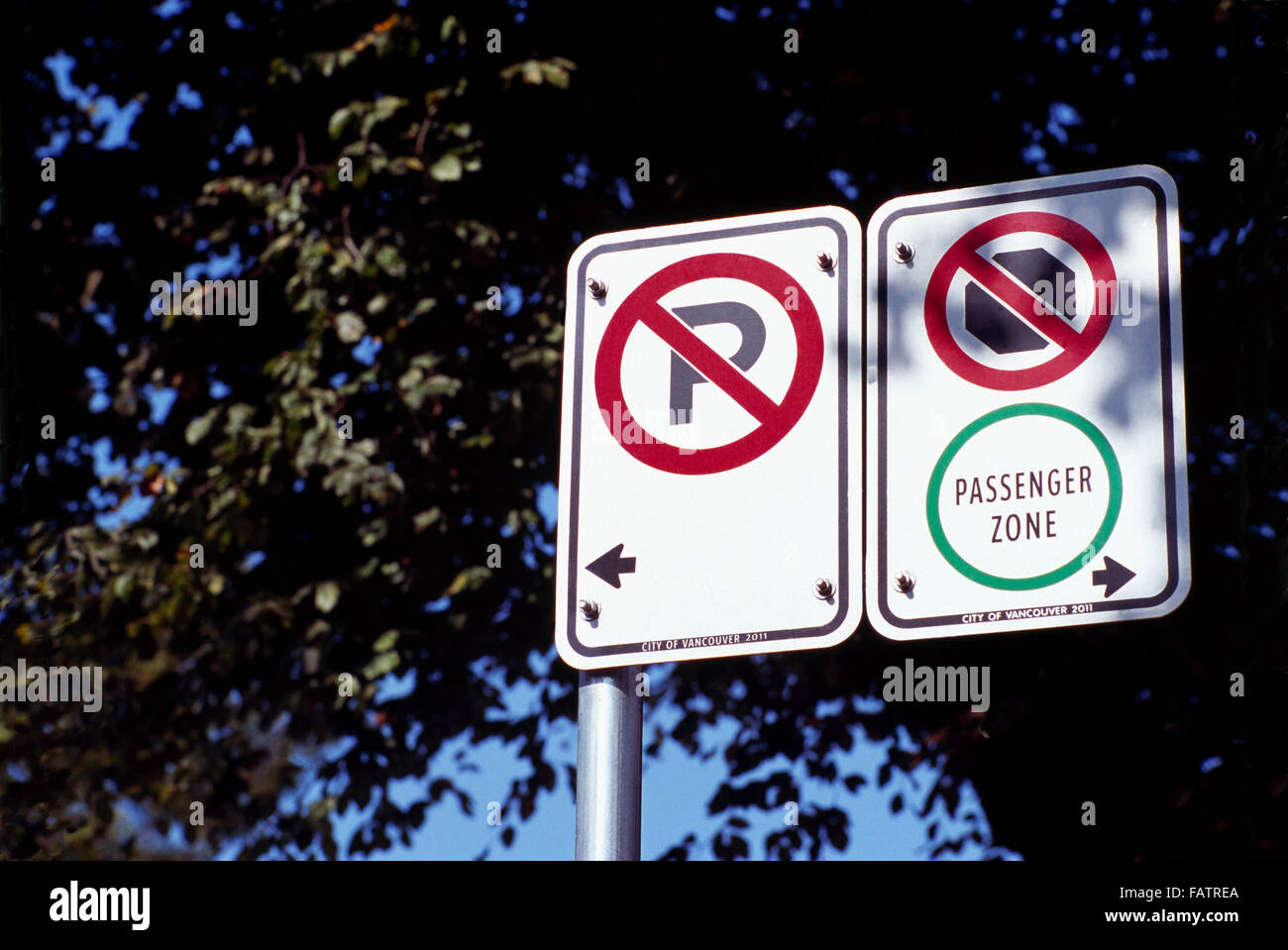 City Bylaw Sign - No Parking, No Stopping, Passenger Zone Stock Photo ...