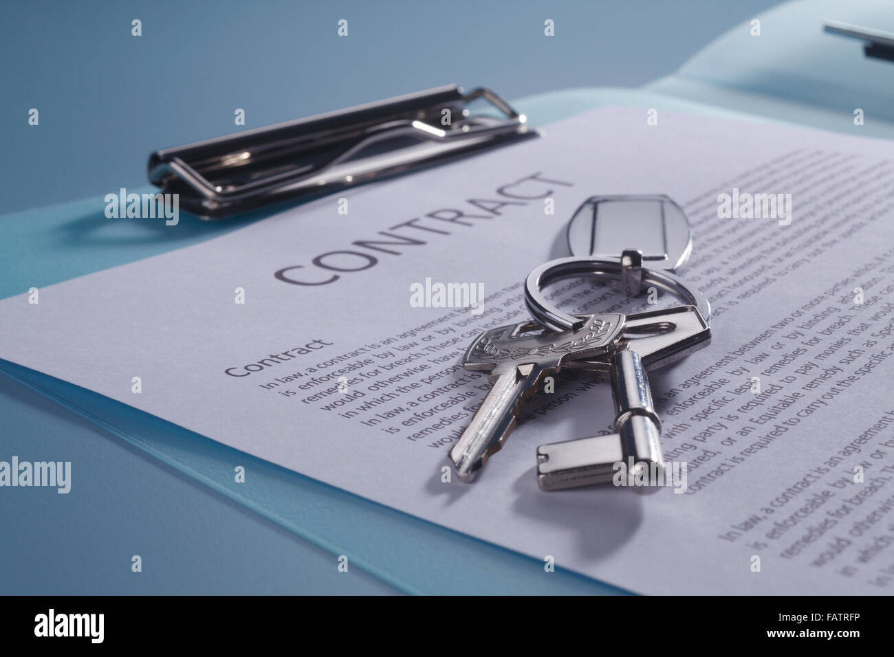 close of the key on the contract form Stock Photo - Alamy
