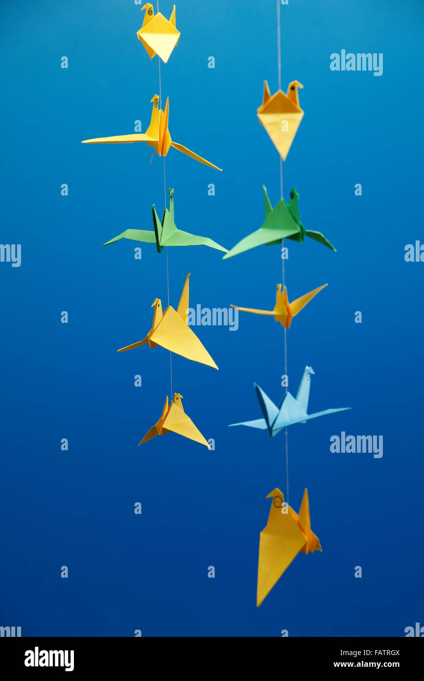 many of origami bird hanging in a row Stock Photo - Alamy