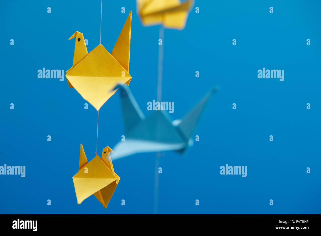 many of origami bird hanging in a row Stock Photo - Alamy