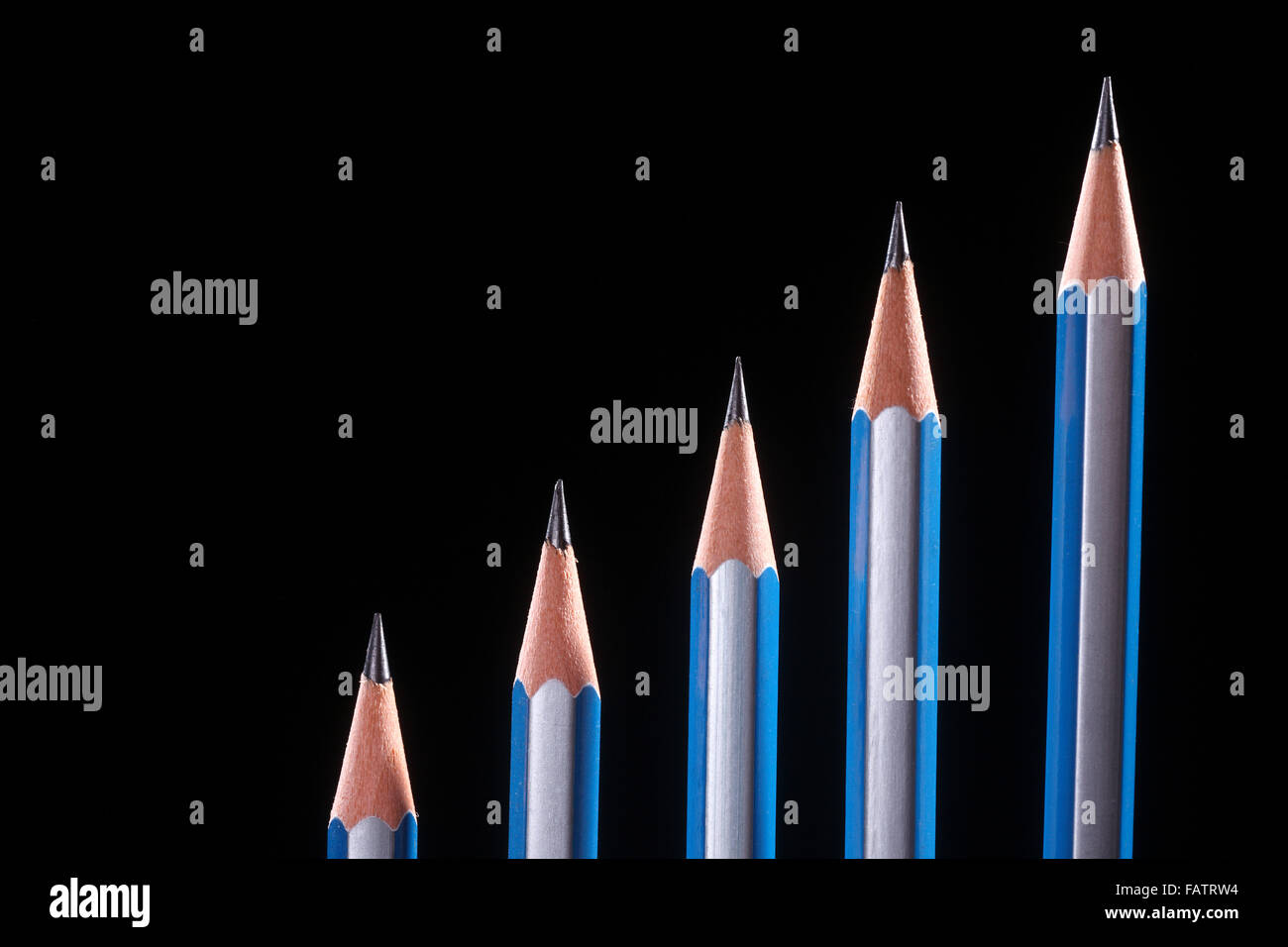 pencil form a graph on the dark background Stock Photo - Alamy